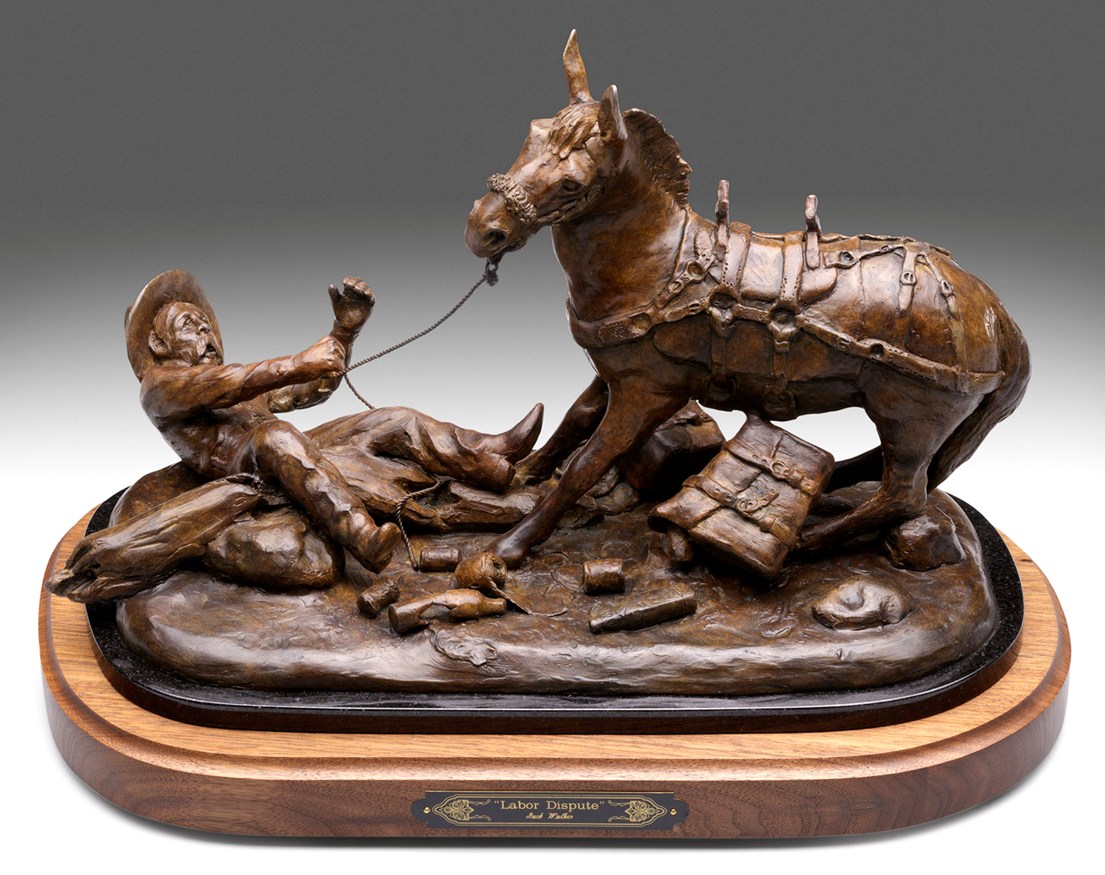 bronze sculpture by Jack Walker. title: “Labor Dispute” – Chisholm Country